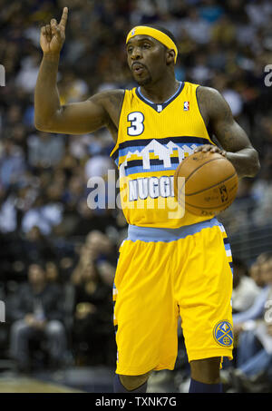 Denver Nuggets' Ty Lawson (3) calls a play against Kyrie Irving (2) and ...