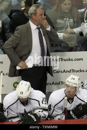 Los Angeles Kings head coach Jim Hiller look on from the bench during ...