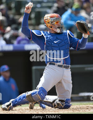 New York Mets catcher John Buck hands off the ball to starting pitcher ...