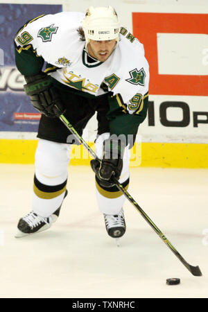 Dallas Stars center Mike Modano (9) controls the puck on the ice during ...