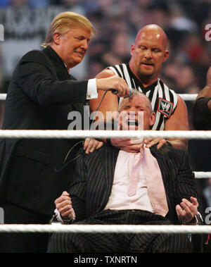 Wrestler/referee Stone Cold Steve Austin (C) looks on while World ...