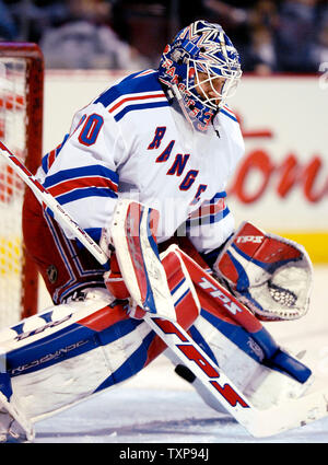 New York Rangers goaltender Henrik Lundqvist blocks a shot from the ...