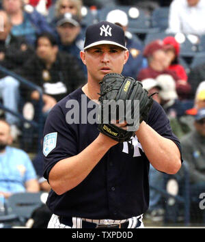 FILE - New York Yankees pitcher Clarke Schmidt reacts as he leaves the ...