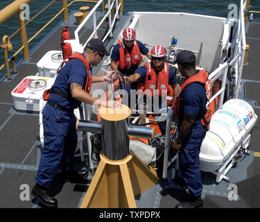 Coast Guard personnel aboard the Coast Guard Cutter Sycamore set a ...