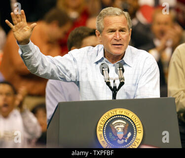 President George W. Bush greets the crowd after a panel discussion ...