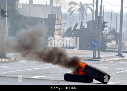 An Israeli tank takes position in the southern Christian village of ...