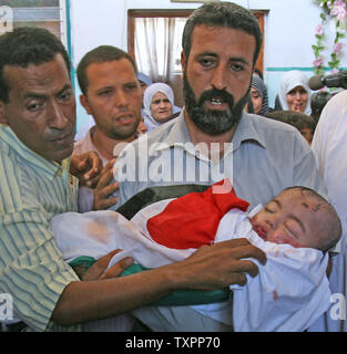 Khaled Wahba carried by his father during his funeral after Khaled was ...