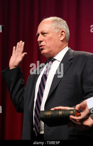 Illinois Governor Pat Quinn, Jr. watches the color guard take the stage ...