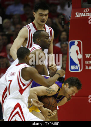 Houston Rockets guard Kyle Lowry, left, drives past Toronto Raptors ...