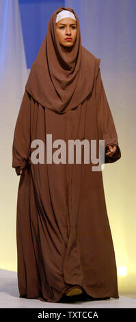 An Iranian model wears an Islamic dress made by Iranian designers at a ...