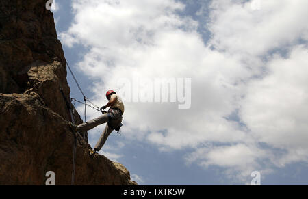 An Iranian rock climber makes her way up Maryam Rock in the north part ...