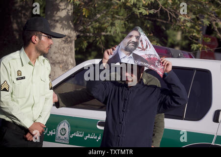 A supporter holds a poster of presidential candidate Ivan Cepeda of the ...