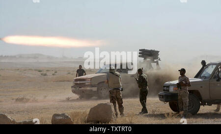Fighters from the Popular Mobilization Forces, attends the funeral of a ...
