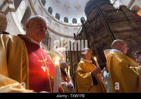 Priests circle the Holy Sepulchre during Holy Thursday mass led by the ...