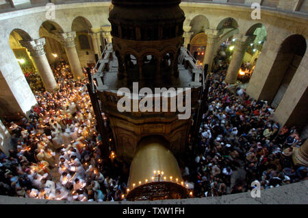 Priests circle the Holy Sepulchre during Holy Thursday mass led by the ...