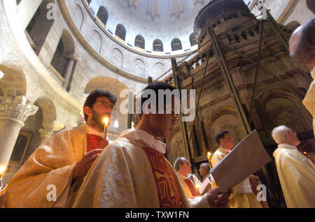 Priests circle the Holy Sepulchre during Holy Thursday mass led by the ...