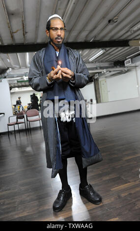 The rapper Shyne lights a cigar before the world premiere of his short ...