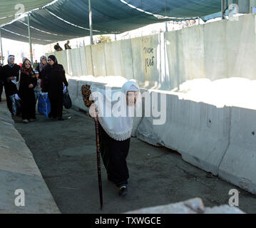 A Palestinian woman walks through Checkpoint 300, Bethlehem, West Bank ...