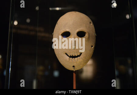 A mask from the Neolithic period ( 9,000 years ago) is displayed in the ...