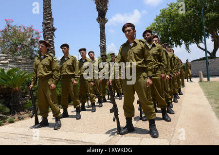 An Israeli military honor guard waits for the arrival of the flag ...