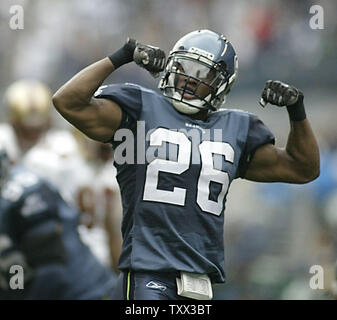 Seattle Seahawks free safety Ken Hamlin, left, playfully knocks away a ...