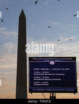 The sun rises near the Washington Monument early, Wednesday, July 1 ...