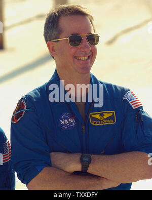 Astronaut Stephen K. Robinson, STS-114 mission specialist, anchored ...
