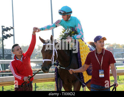Jockey Florent Geroux celebrates after riding Monomoy Girl to victory ...