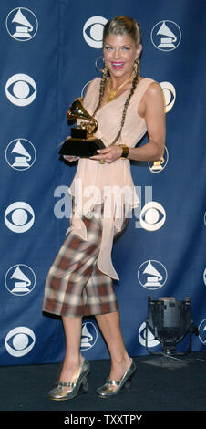 Fergi from The Black Eyed Peas shows off her Grammy backstage at the ...
