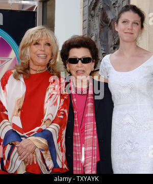 Singer and actress Nancy Sinatra (L) savors the moment with her ...