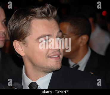 Fans of film star Leonardo DiCaprio scream with delight as they catch a ...