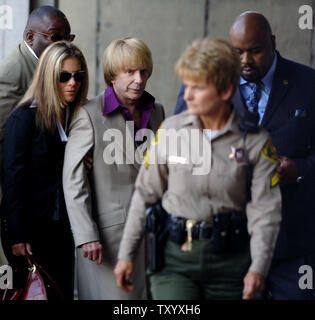 Music producer Phil Spector (C), accompanied by his wife, Rachelle ...