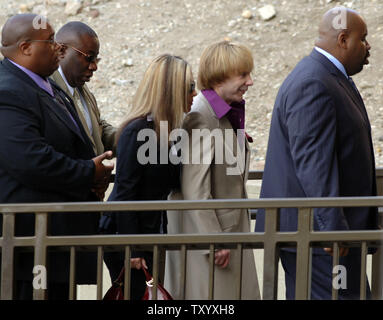 Music producer Phil Spector (C), accompanied by his wife, Rachelle ...