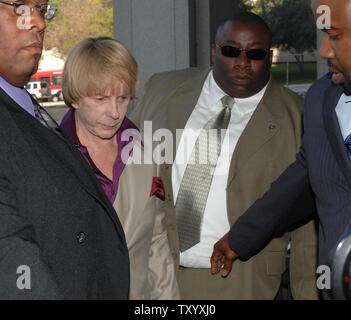 Music producer Phil Spector (C), accompanied by his wife, Rachelle ...