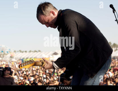 Fran Healy (L) lead singer of Travis talks to bass guitarist Dougie ...