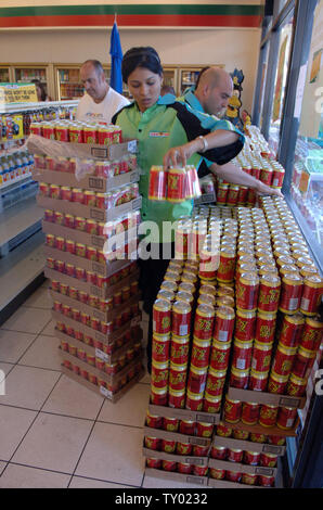 Trisha Shah restocks Buzz Cola at a 7-Eleven convenience store ...