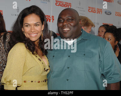 Cast member Faizon Love (R) and a guest arrive for the premiere of the ...