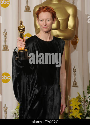 Actress Tilda Swinton poses with her Oscar for Best Supporting Actress ...