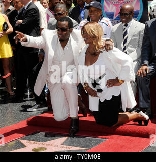 Sean Diddy Combs hugs his mother Janice during dedication ceremonies ...