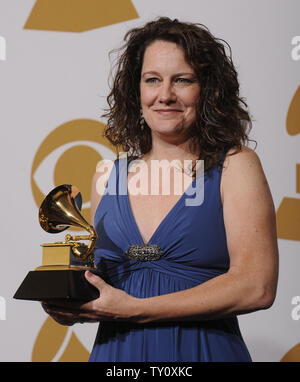 Kelly Carlin McCall holds the Grammy Award won by her late father ...