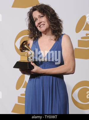 Kelly Carlin McCall holds the Grammy Award won by her late father ...