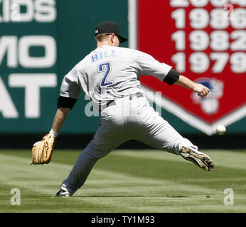Toronto Blue Jays' Aaron Hill, right, slides home safely as Boston Red ...