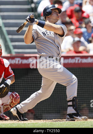 Los Angeles Angels' Mark Teixeira slides safely into home as he beats ...