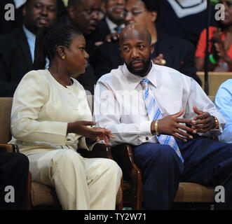 Trayvon Martin's parents Tracy Martin, left, and Sybrina Fulton pose ...