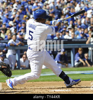 Los Angeles Dodgers Juan Uribe hits a double in the ninth inning of a ...