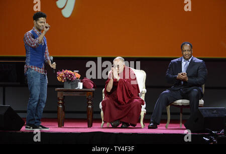 The Dalai Lama (L) listens with Inglewood Mayor James T. Butts (R) as ...