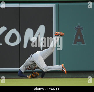 Houston Astros catcher Hank Conger talks to starting pitcher Lance ...