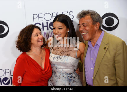 Actress Gina Rodriguez and boxing referee Genaro Rodriguez pose ...