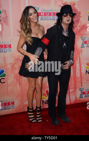 Musician Niki Sixx, right, and Courtney Bingham attend the iHeartRadio ...