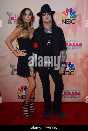 Musician Niki Sixx, right, and Courtney Bingham attend the iHeartRadio ...